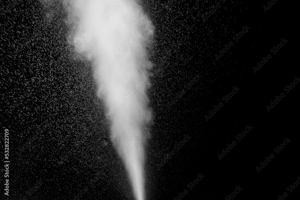 Curly white steam rising up and splashing water scattering in different ...