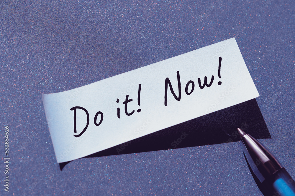Do it now motivator message written on sticky paper, office sticker ...