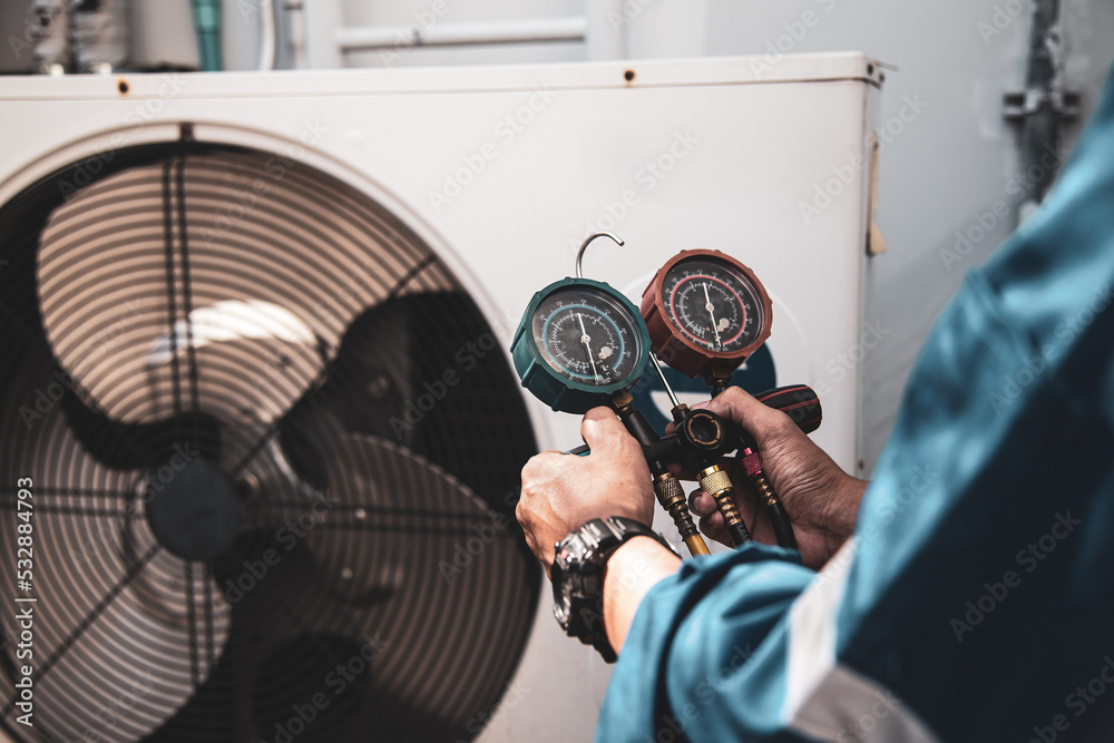 Heat and Air Conditioning, HVAC system service technician using ...