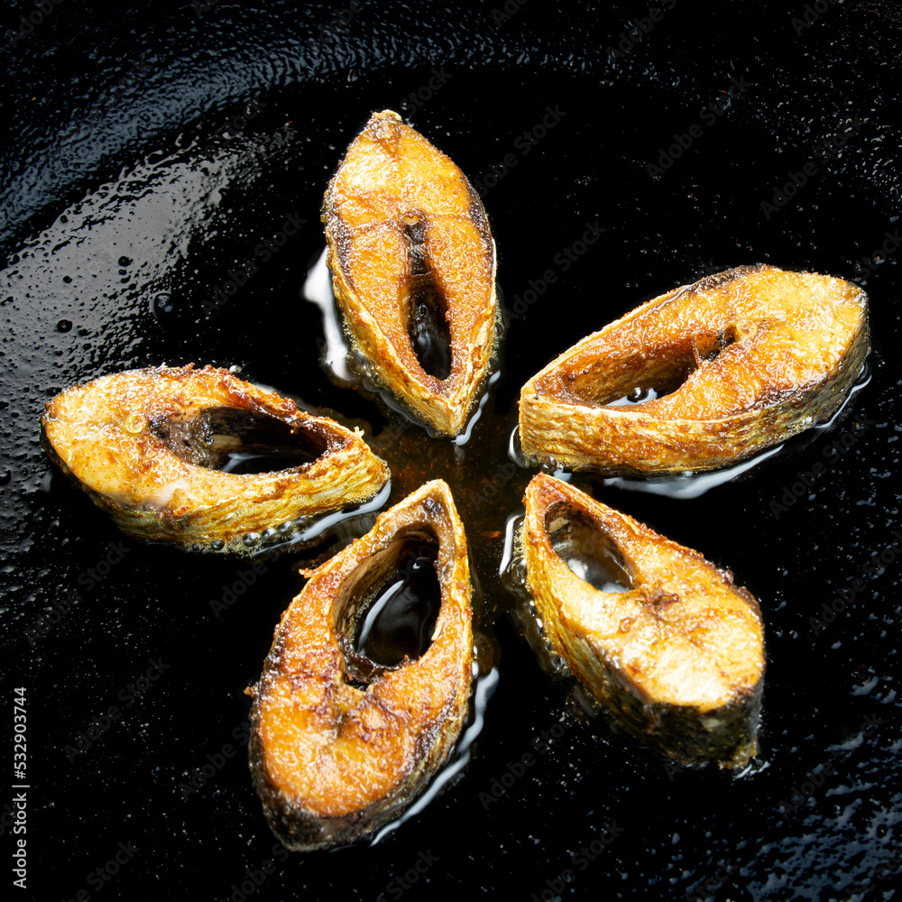 Ilsha fring on black pan. Hilsa fry is popular in pohela boishakh among ...