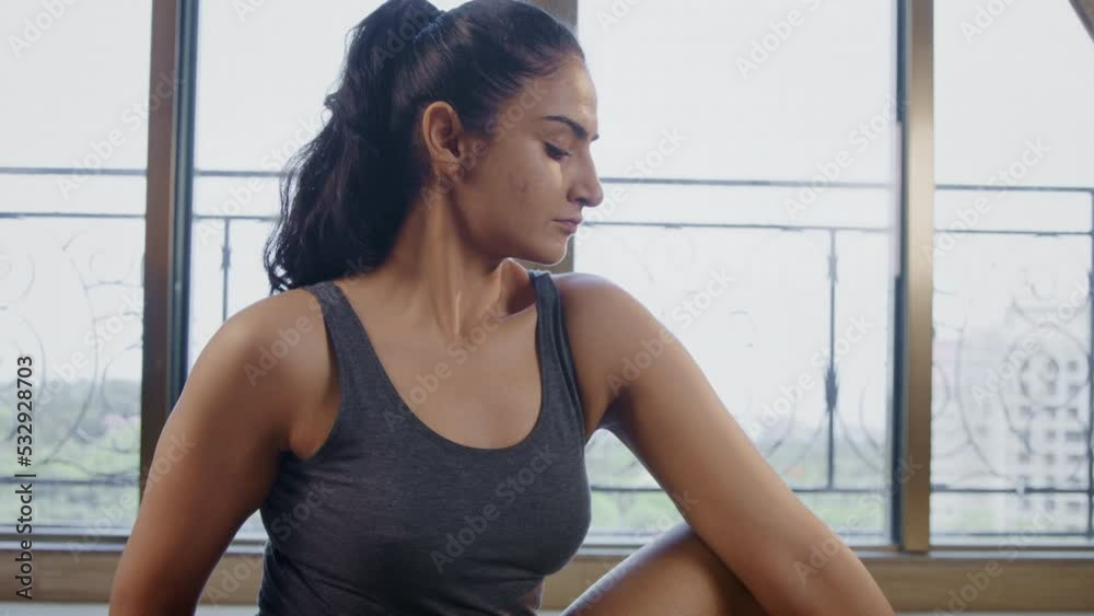 Young attractive fit Indian Asian Woman or female performing an ...