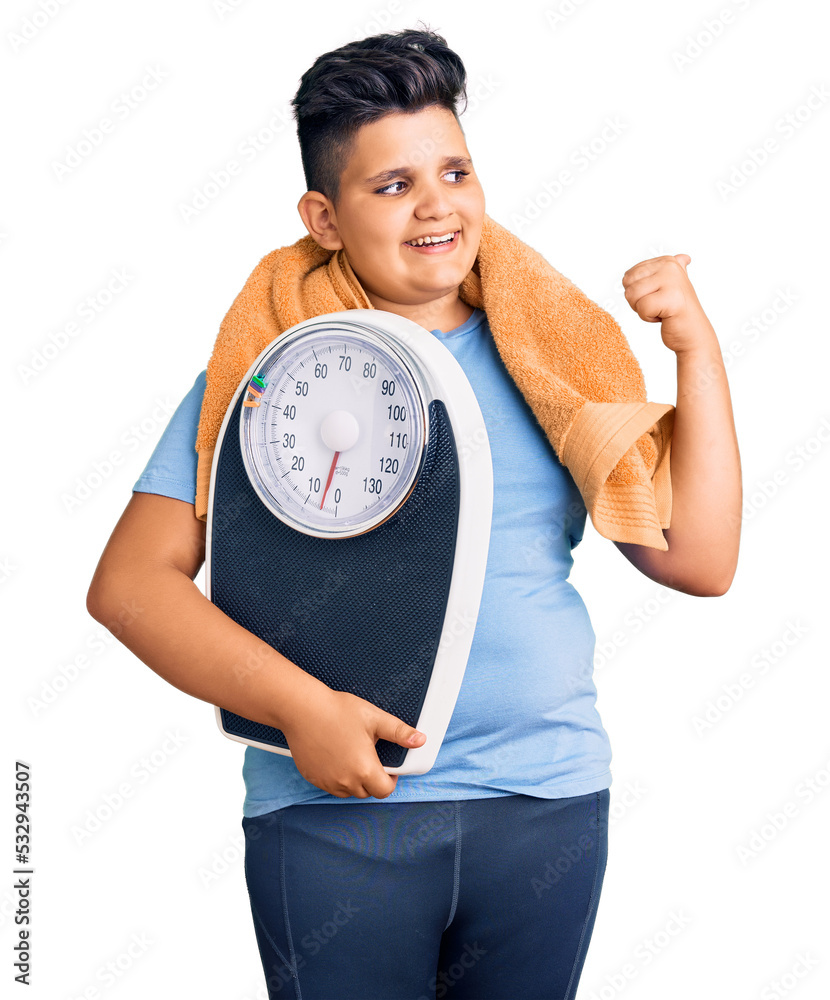 Little boy kid holding weight machine to balance weight loss pointing ...