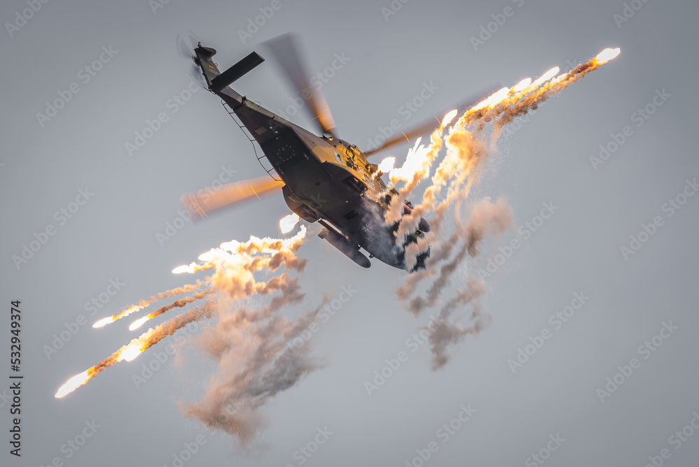NH90 helicopter shooting flares Stock Photo | Adobe Stock