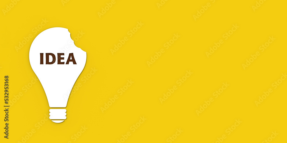 a white bitten light bulb with the inscription idea on a yellow ...