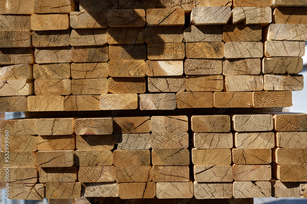 Foto de Wood texture.Stack of wood planks on lumber yard. lumber ...