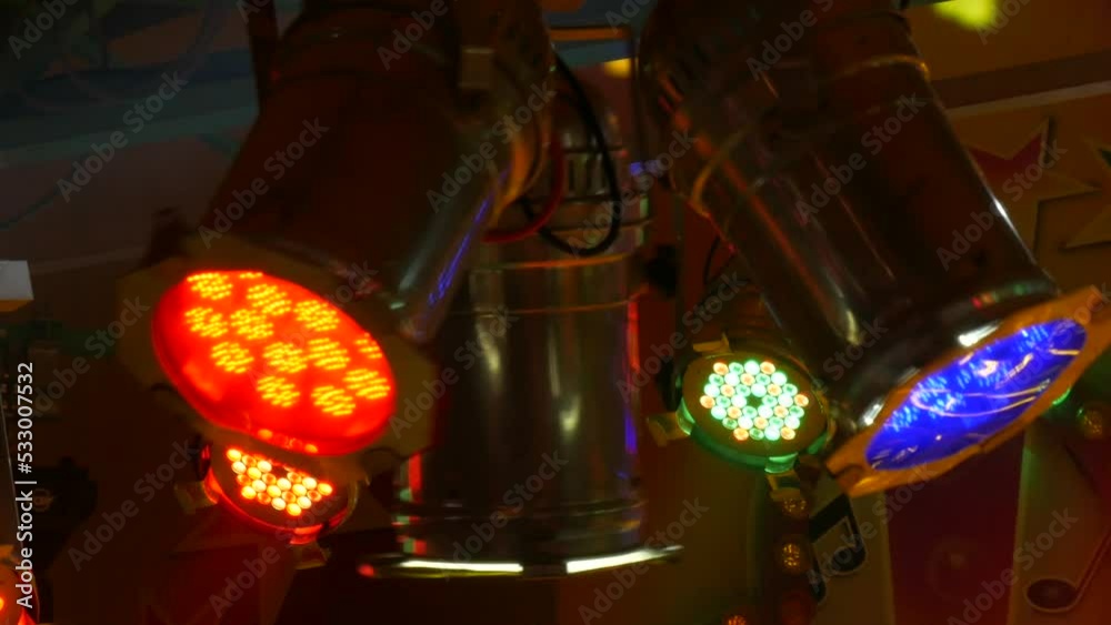 Multicolored ceiling with lighting fixtures on the dance stage. Bright ...