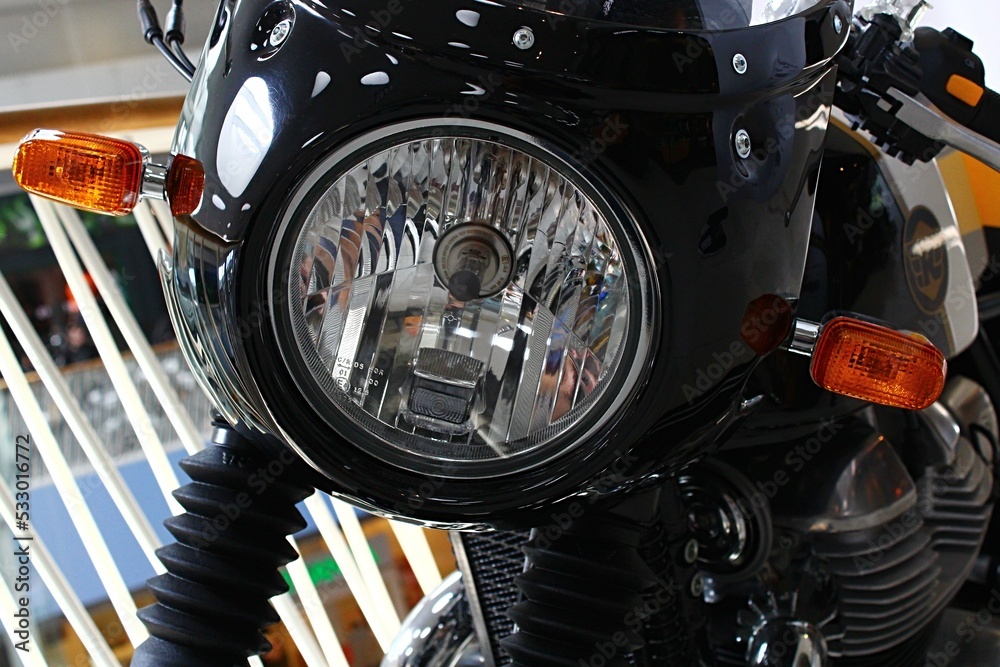 Detail of front mask with round headlight and classical oval orange ...