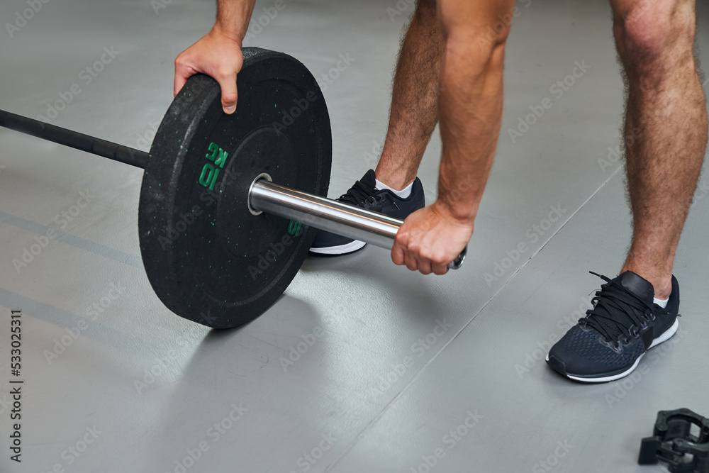 Muscular fit people training, exercising, lifting heavy weight in ...