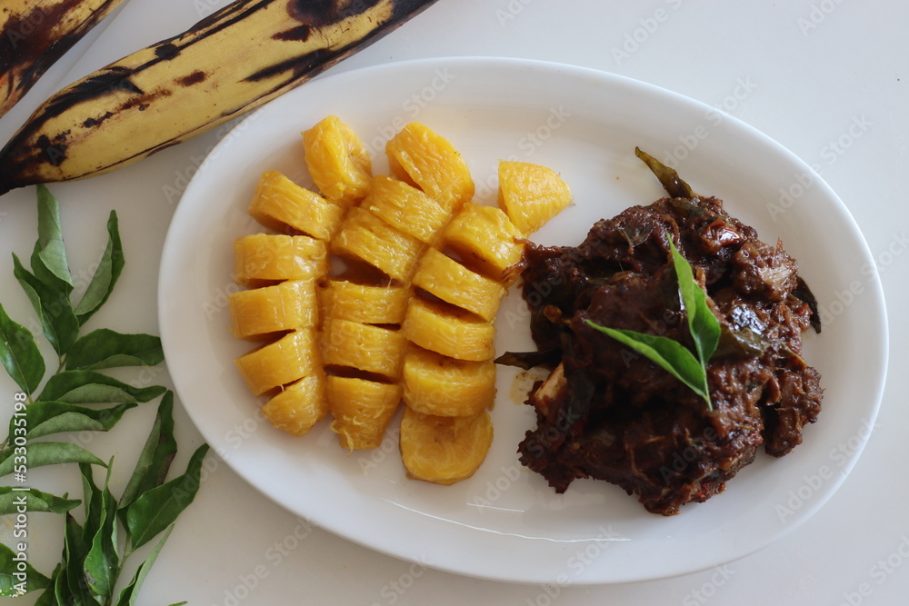 Mutton roast and steamed ripe plantain. A spicy and sweet combination ...