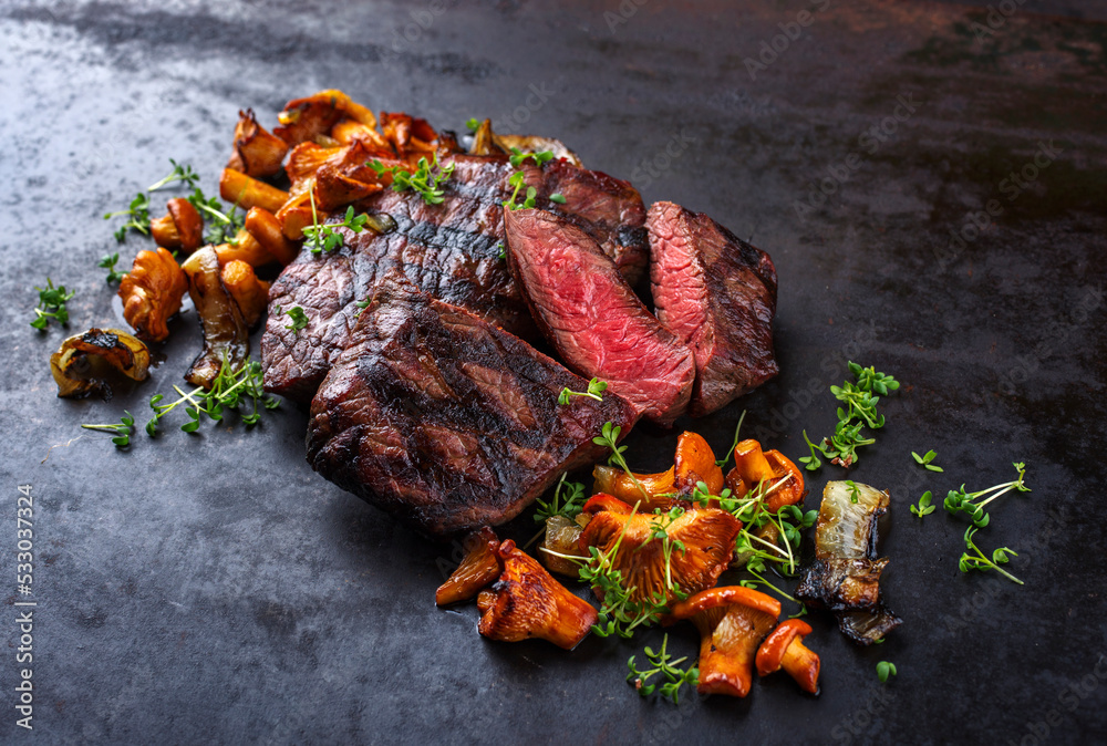 Barbecue angus sirloin beefsteak with chanterelles and onion rings ...