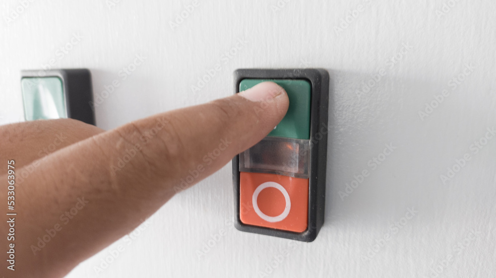 Foto de The Finger touch on the button of machine control panel.Push ...