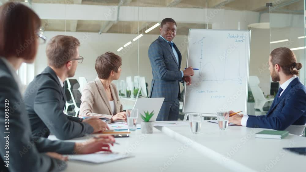 Multi ethnic colleagues gather in modern office boardroom discussing ...
