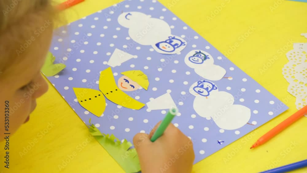 Child making card with funny cows and smiling child with glasses of ...