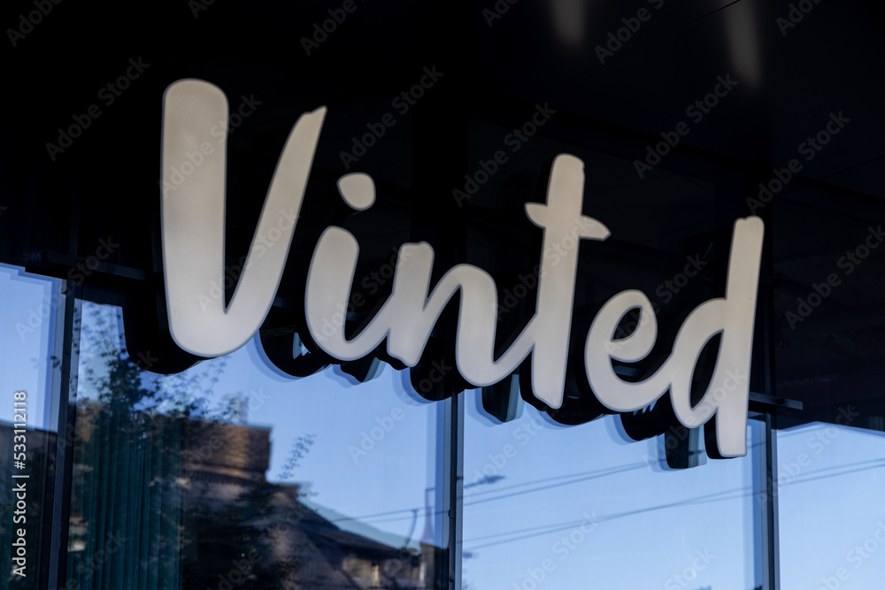 Vinted logo sign on main office, headquarters building wall. Vinted is ...