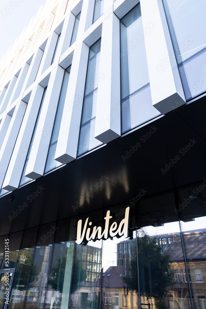 Vinted logo sign on main office, headquarters building wall. Vinted is ...