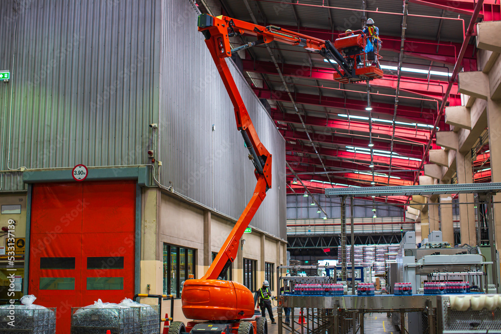 Workers working on the construction site of the new factory industry ...