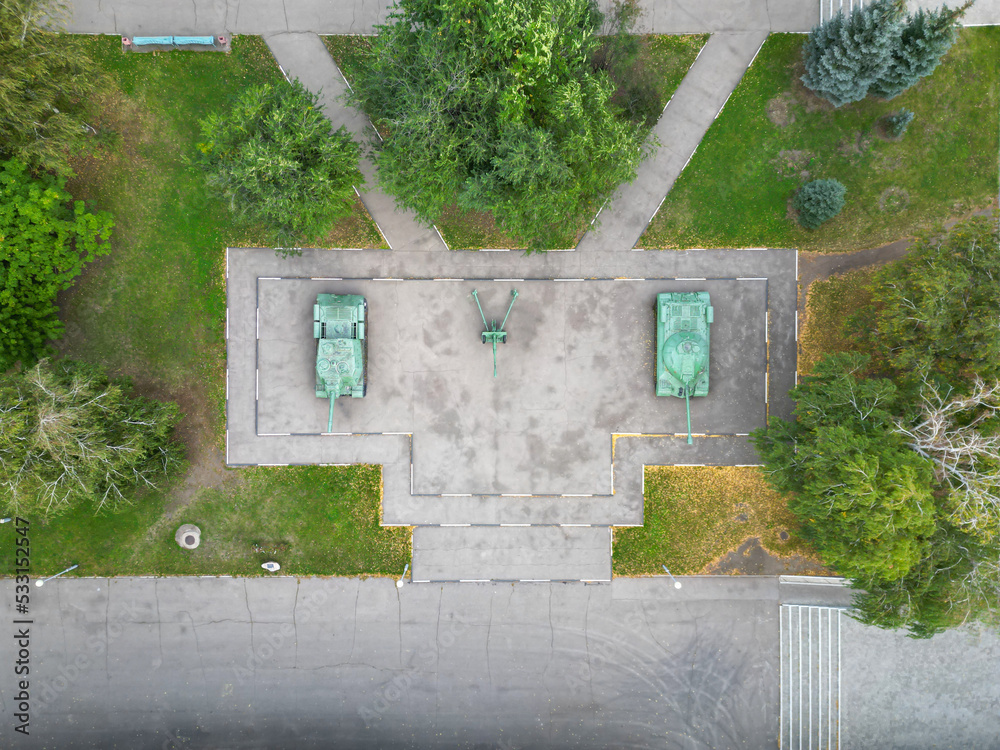 A cannon and two tanks in the open air in the park. Museum of Military ...