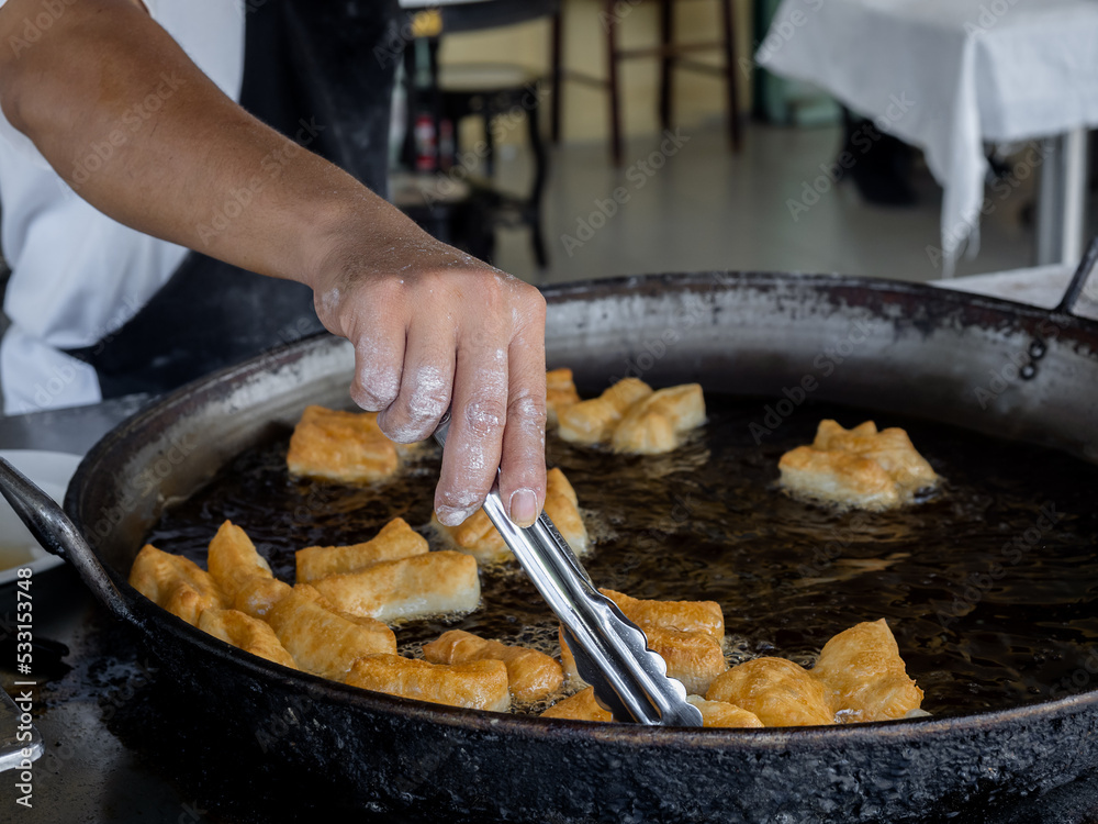 Deep-fried dough sticks or Patongko in Thai, Asian famous street food ...