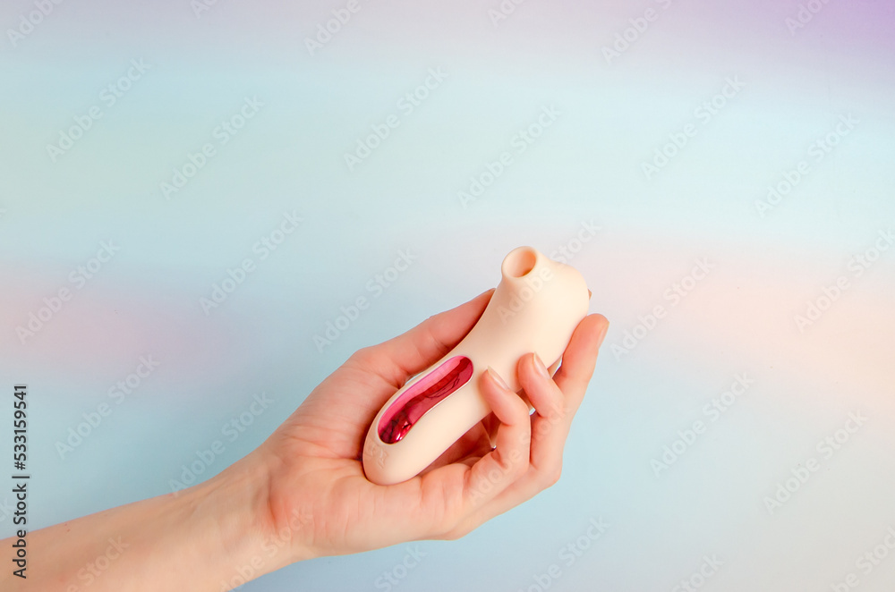 Pink Vacuum Wave Vibrator For Clitoral Stimulation In An Elegant Female