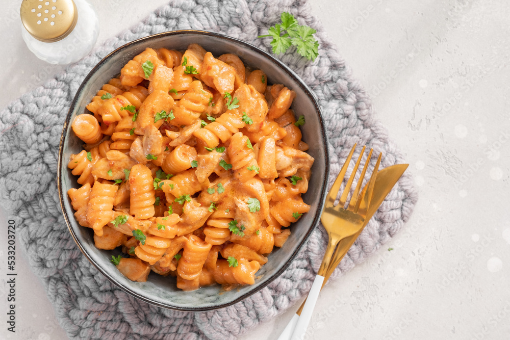 Fusilli pasta with chicken. Cooked in spicy sauce from tomatoes, onion ...