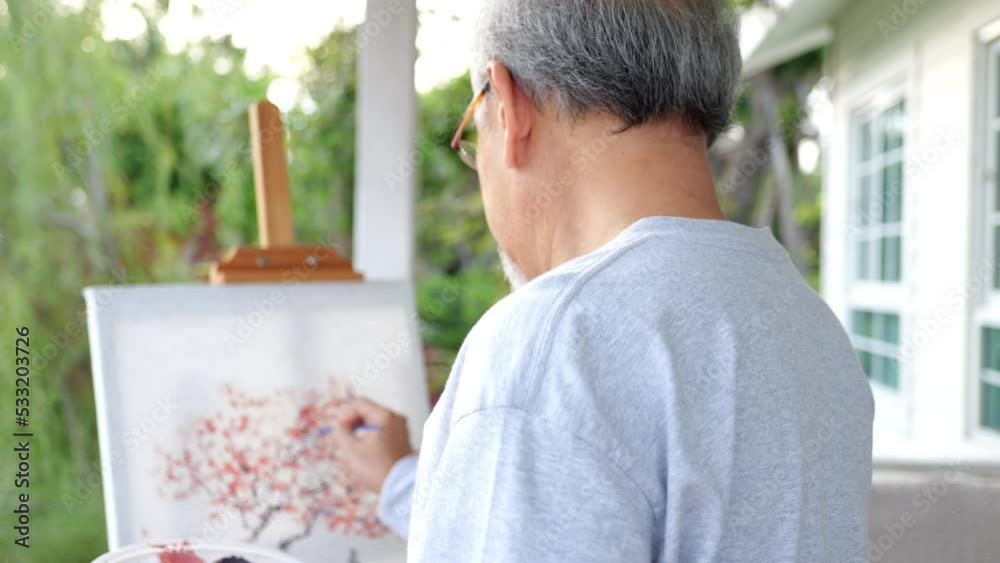 Senior painting picture, old man drawing in garden. Senior holding ...
