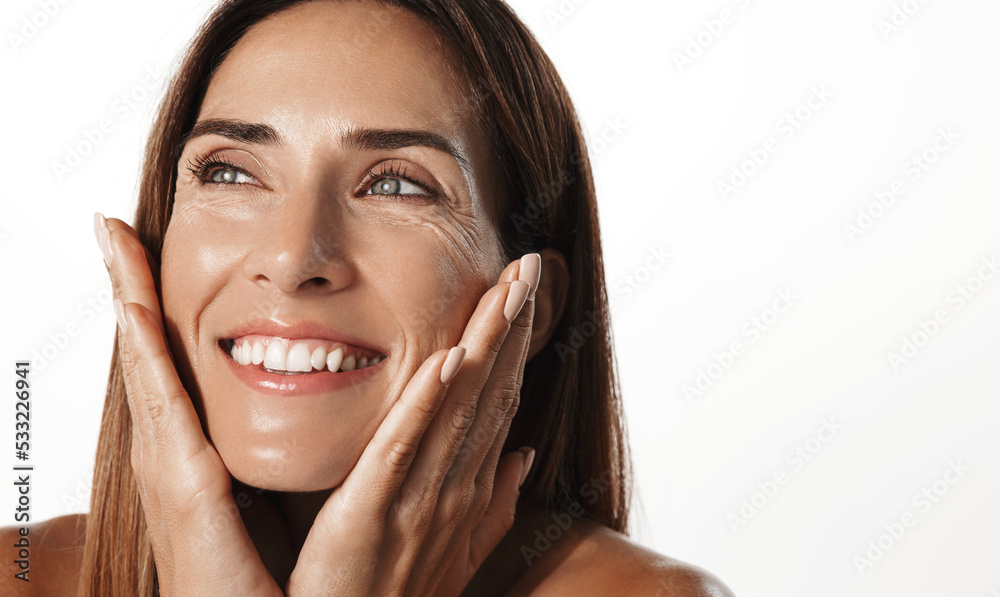 Close up portrait of happy middle-aged woman face, splash of smth on ...