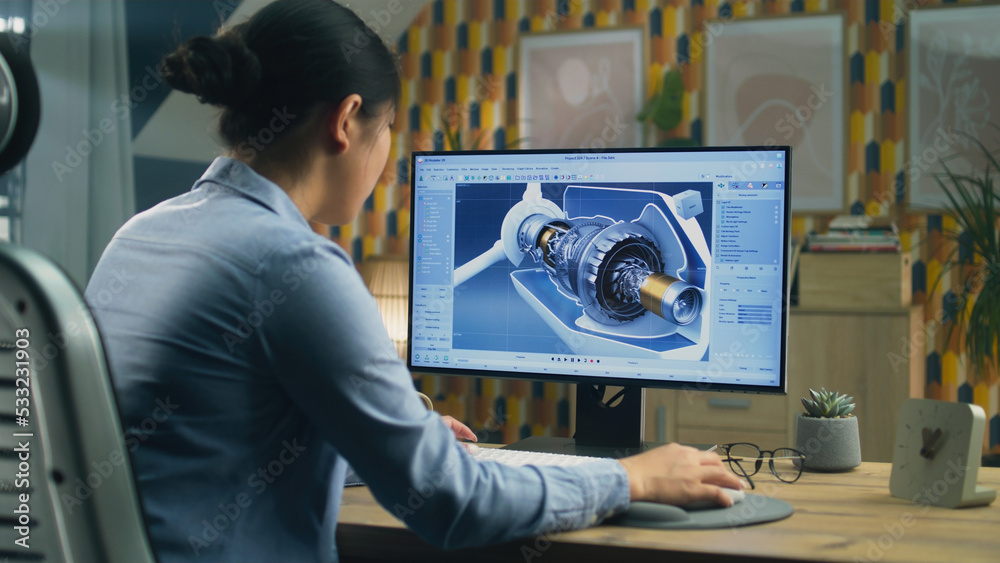 Asian female engineer drawing wind turbine 3D spare part in ...