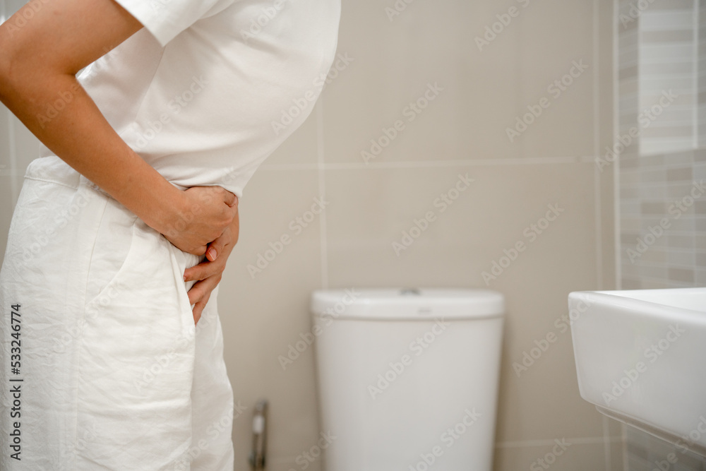 Foto de stomach ache. Sick woman feeling pain with constipation or ...