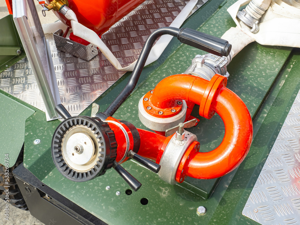 Fire monitor hand-operated. Anti-flame hose is connected to Red pipe ...