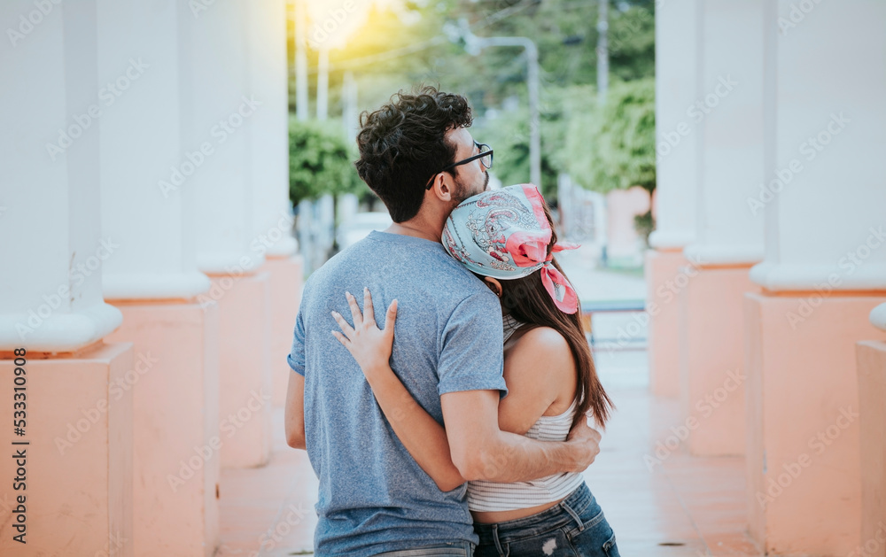 Back view of young woman hugging her boyfriend. Back view of girl ...