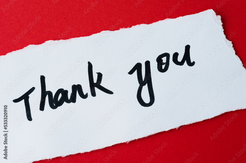 Handwritten text Thank you on torn paper Stock Photo | Adobe Stock