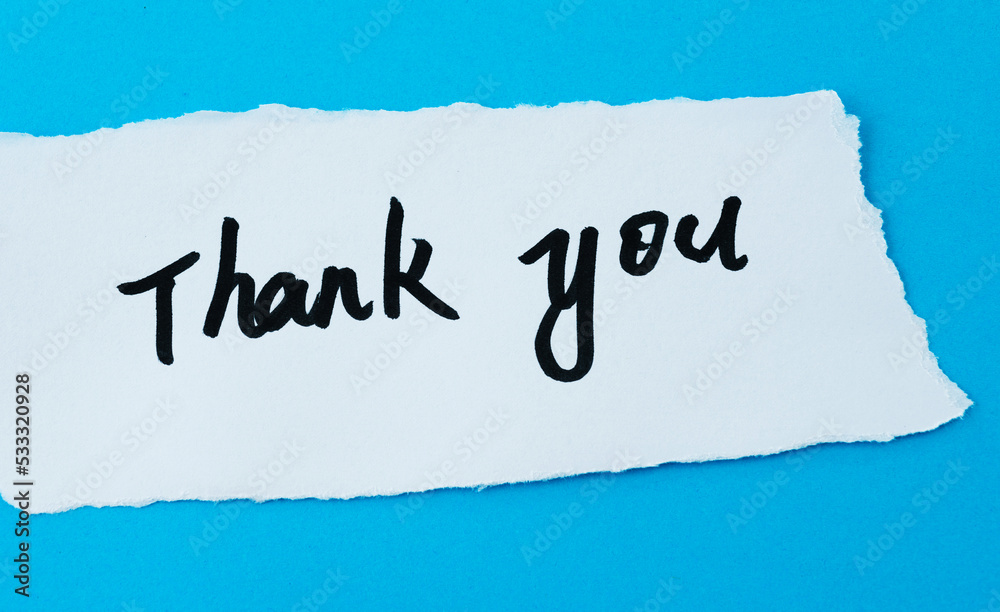 Handwritten text Thank you on torn paper Stock Photo | Adobe Stock