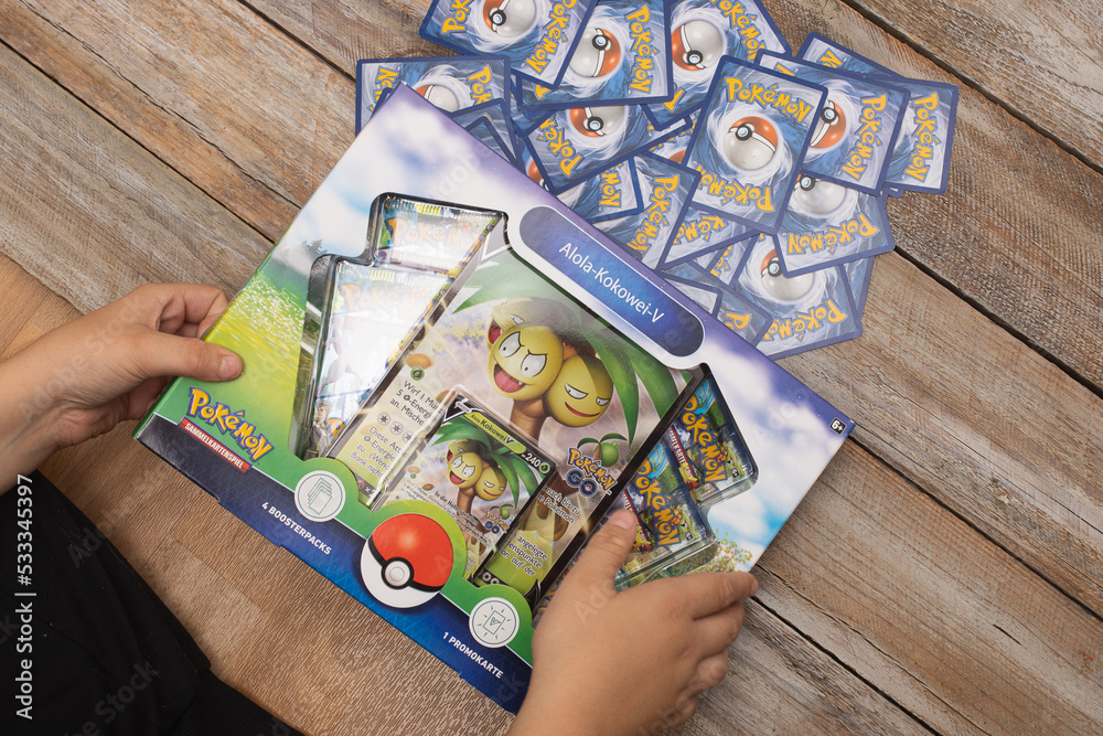 Boy holding card from special boy of pokemon trading cards Stock Photo ...
