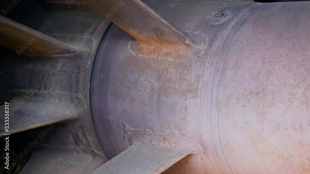 Close-up of a jet engine combustion chamber made of titanium and heat ...