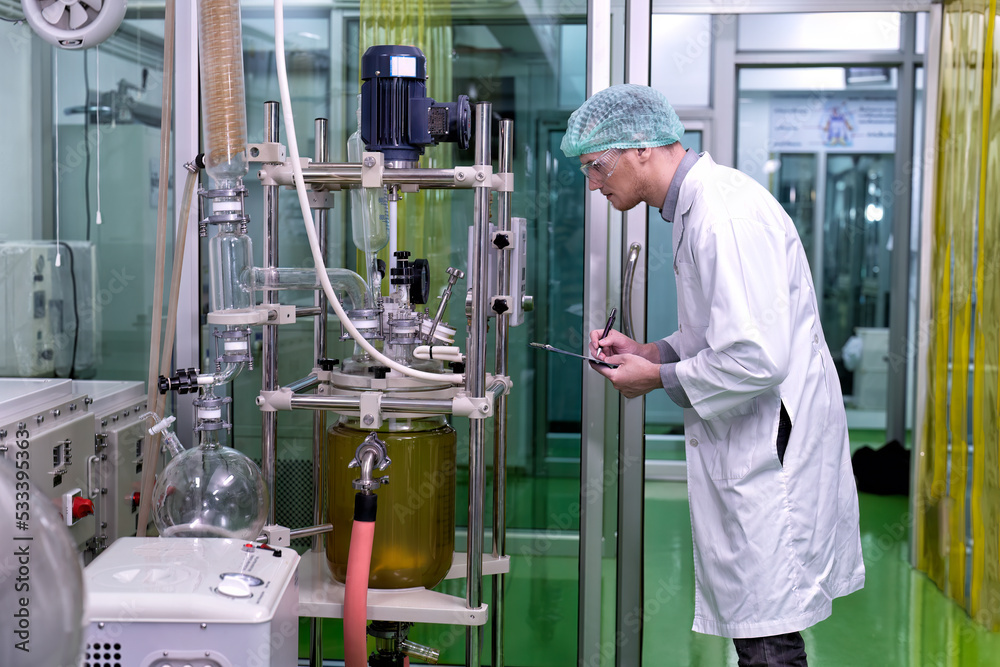 maintenance engineer scientist routine check the distillation glass ...
