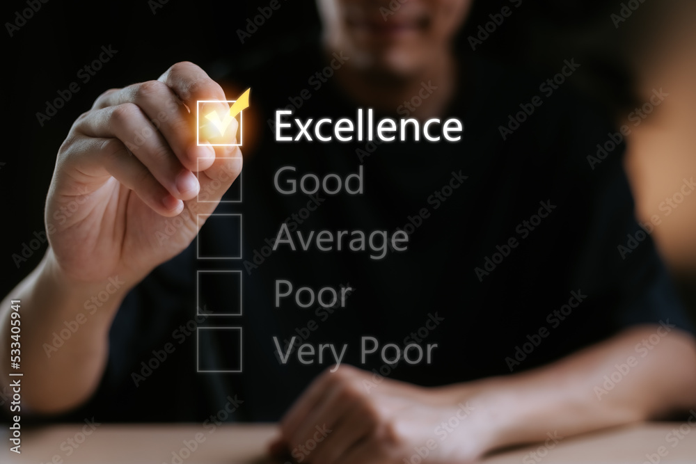 Businessman hand putting check mark a checkbox on excellent for a ...