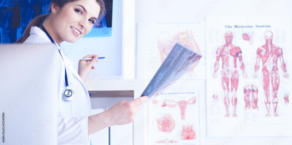 Young professional female doctor examining patient's x-ray Stock Photo ...