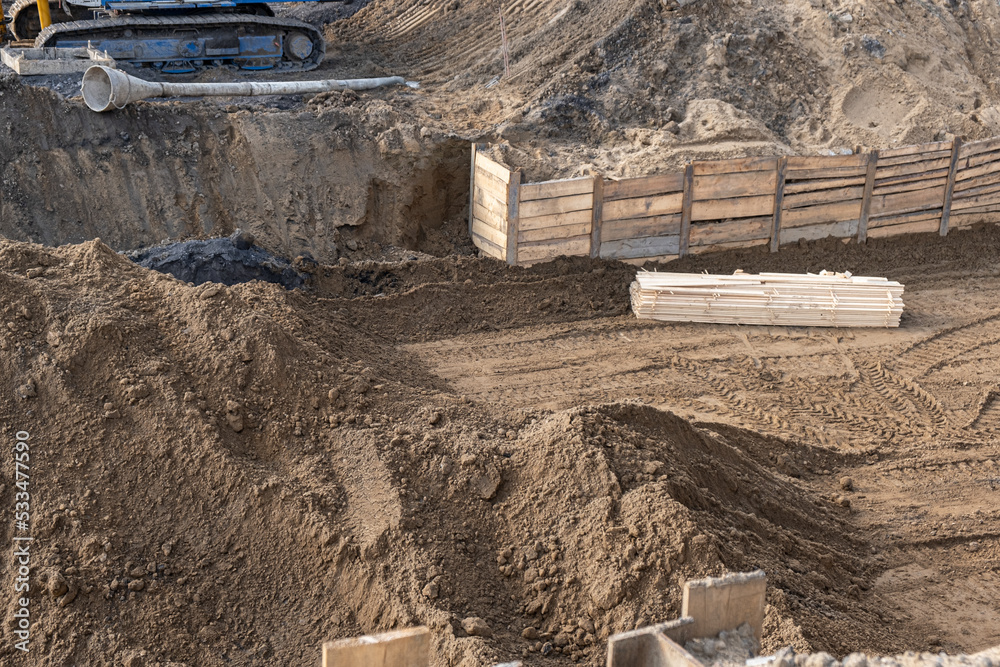 Underground work, digging into the ground of the lower floors on the ...