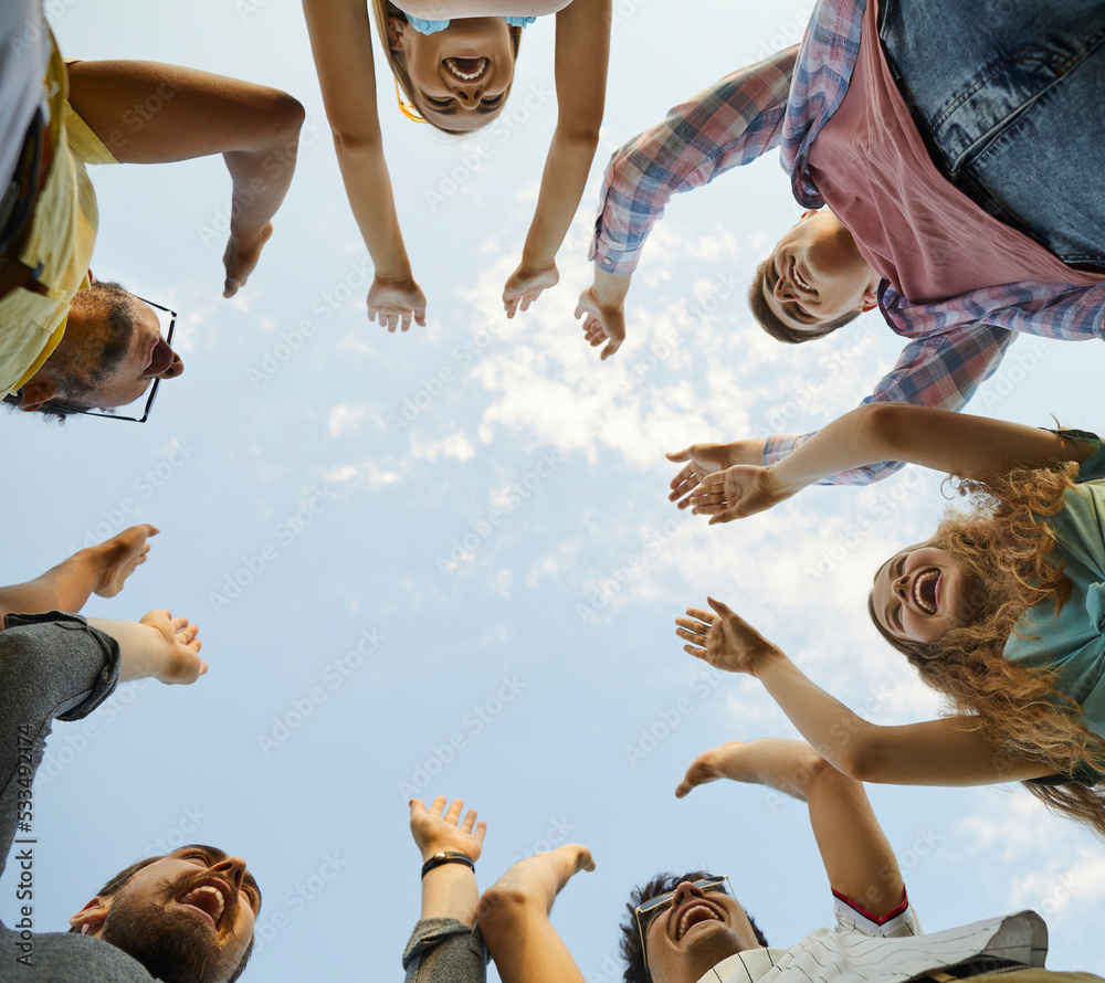 Cheerful friends having fun together. Diverse team of different happy ...