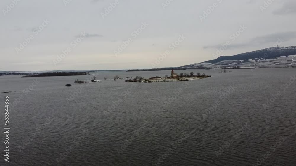 Nove mlyny reservoir and in the background the flooded church of St ...
