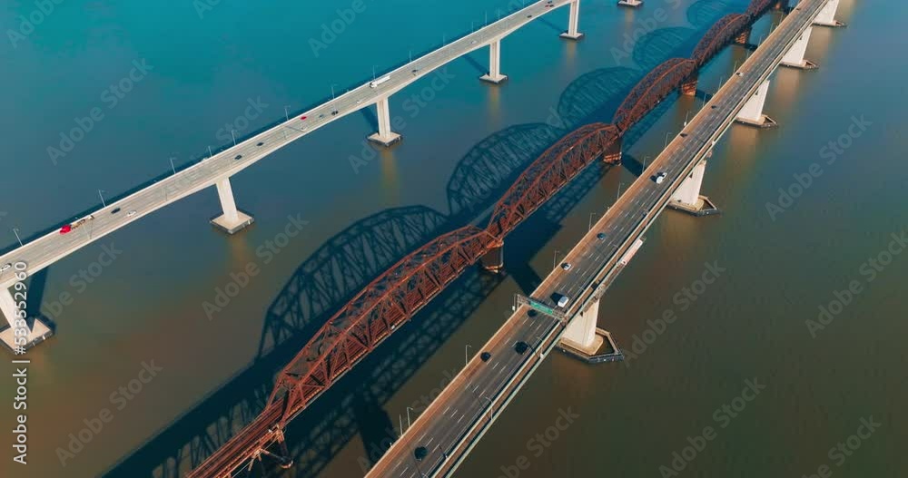 Beautiful simple bridges with one-way highways. Multiple cars moving by ...