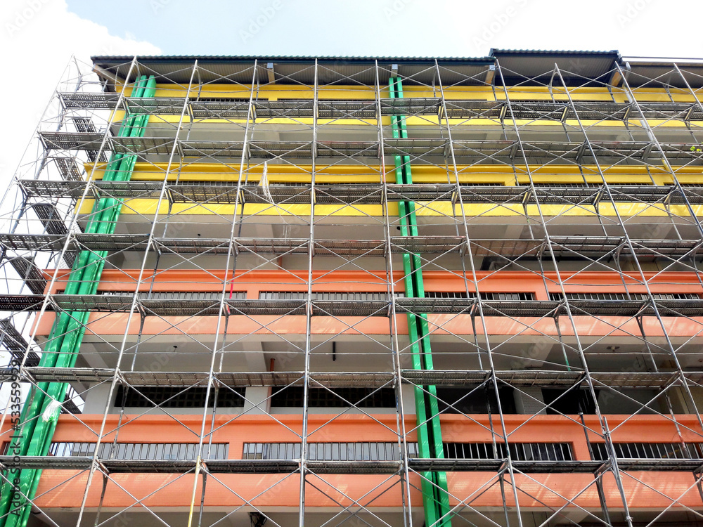 Scaffolding house. School. Building. High-rise, renovation. Scaffolding ...