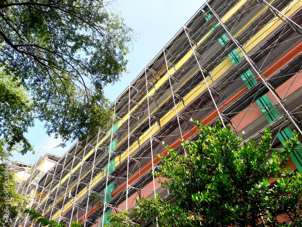 Scaffolding house. School. Building. High-rise, renovation. Scaffolding ...