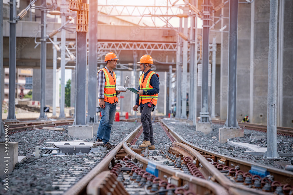 Engineer under inspection and checking construction process railway ...