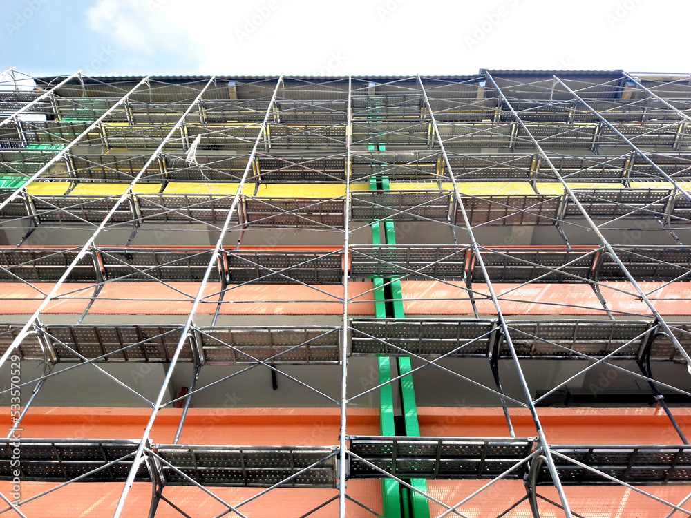 Scaffolding house. School. Building. High-rise, renovation. Scaffolding ...