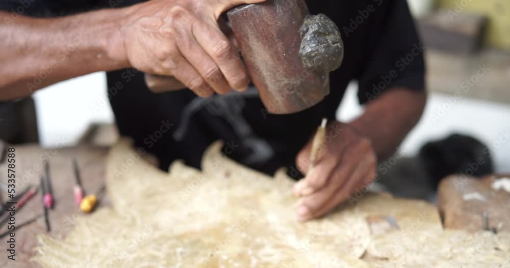 Process of making Wayang shadow puppet. Wayang kulit is a traditional ...