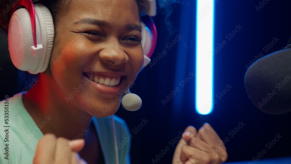 Winner gamer portrait, Young wearing headphones playing computer game ...