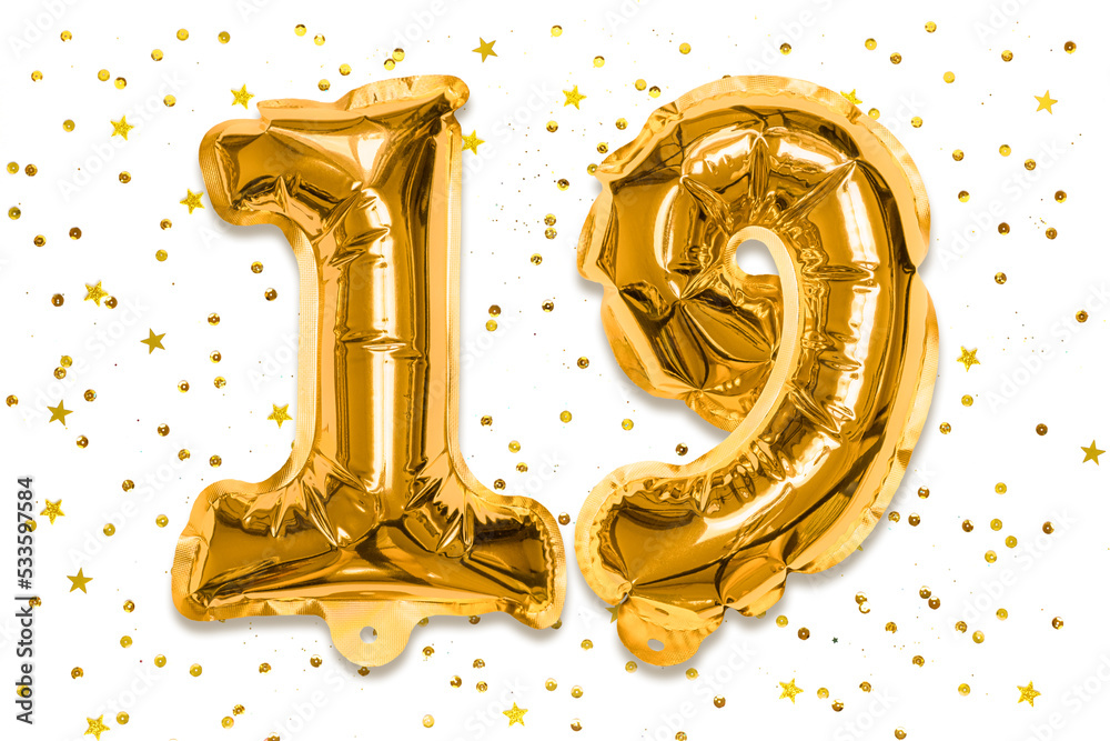 The number of the balloon made of golden foil, the number nineteen on a white background with ...