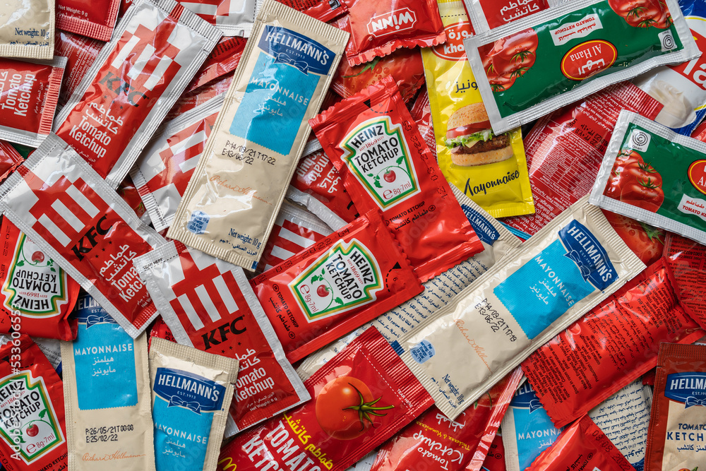 Various brands of tomato ketchup and mayonnaise sachet packs. Stock ...