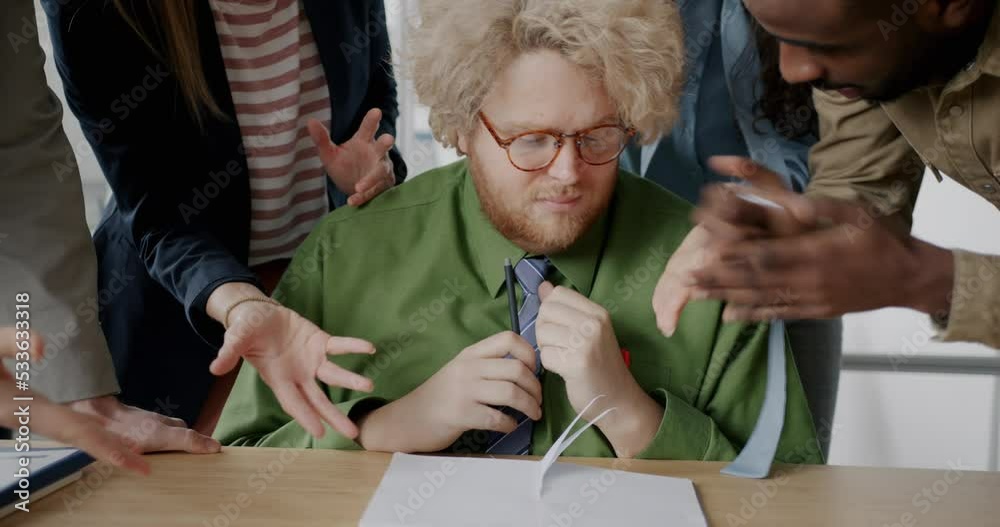 Chubby young man is suffering from abuse and bullying in workplace ...